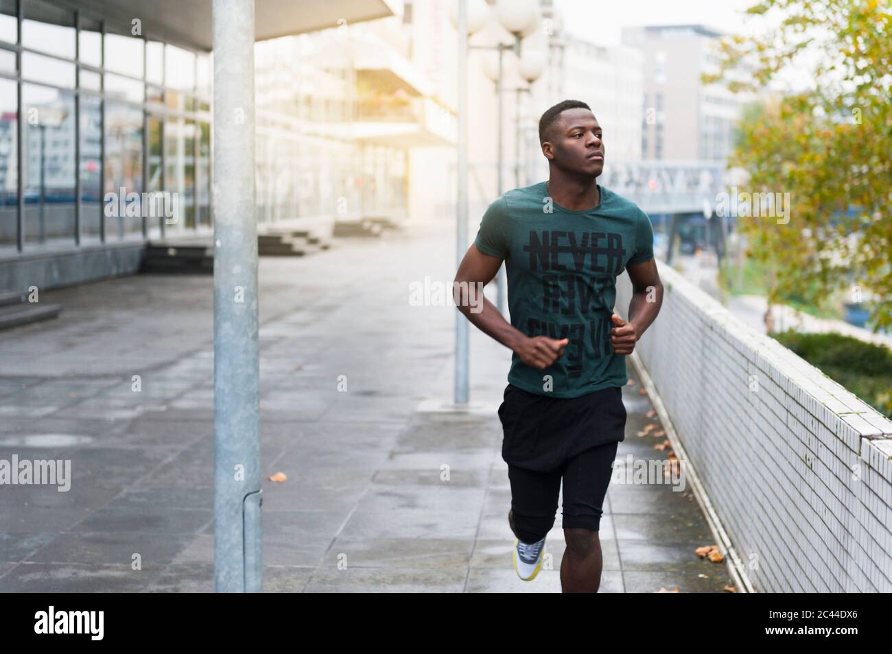 Young man jogging outdoors hi-res stock photography and images - Alamy