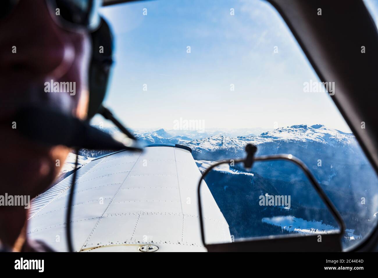 Austria, Tyrol, Steinberg am Rofan, Pilot looking through window during ...
