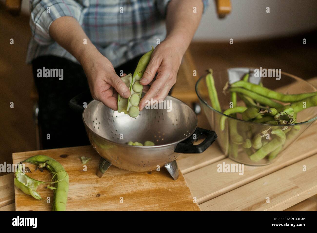 Woman peeling vegetables hi-res stock photography and images - Alamy