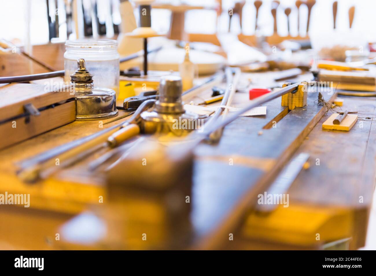 Violin making, workbench with tools Stock Photo - Alamy
