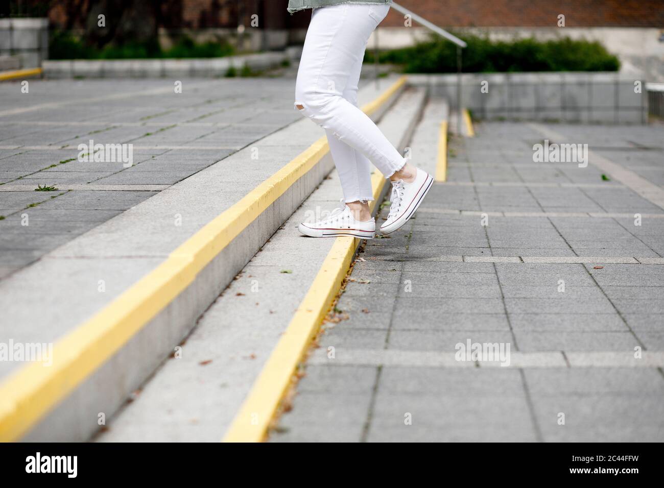Woman up steps hi-res stock photography and images - Alamy