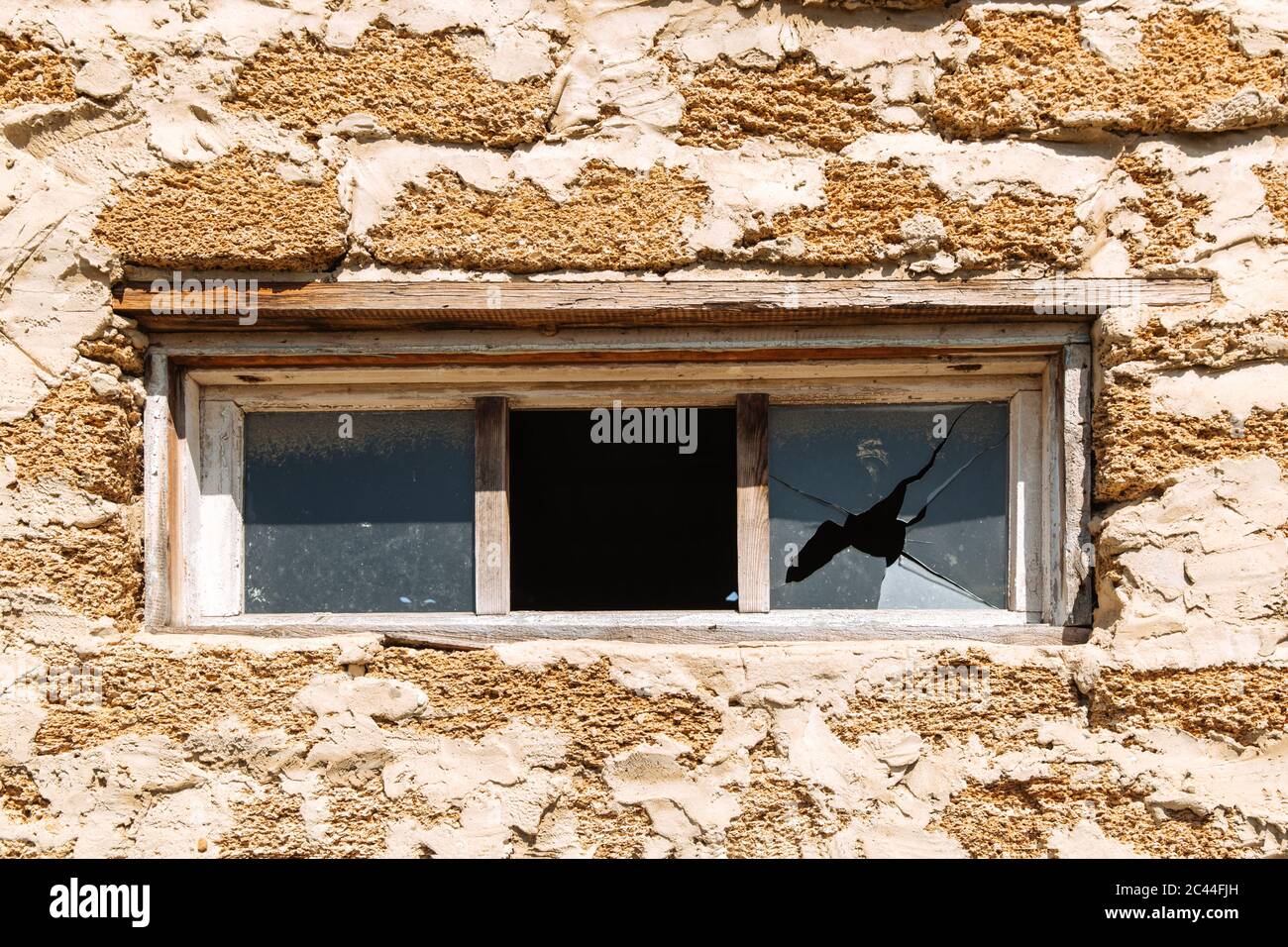Rough texture of a brick wall made of shells. Broken glass in a ...