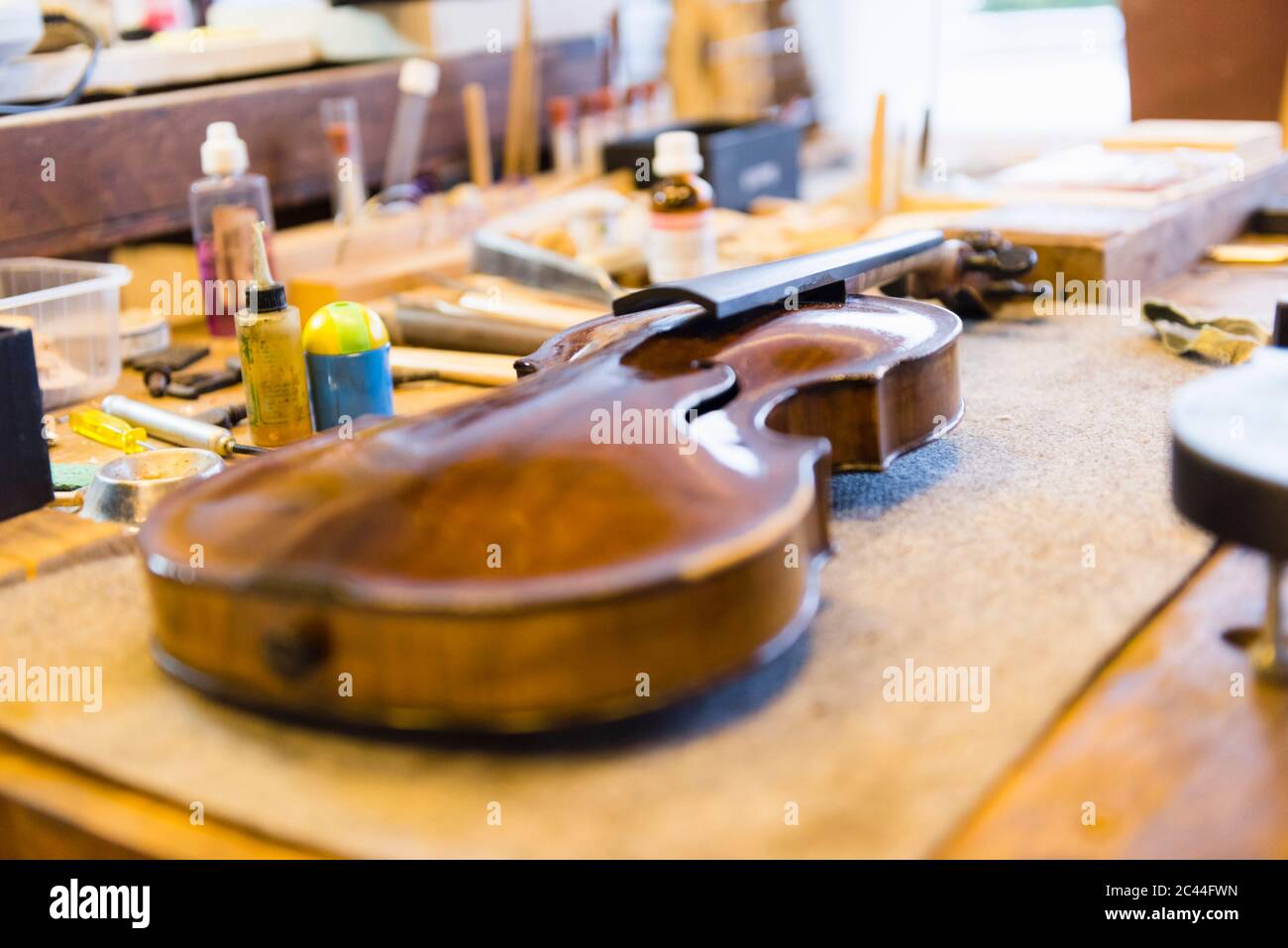 Violin making, violin on workbench Stock Photo - Alamy