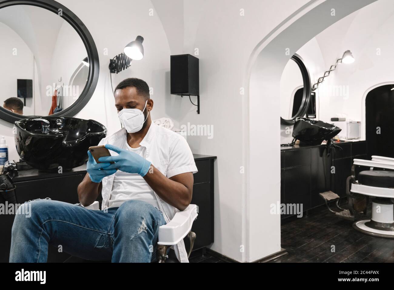 Barber wearing surgical mask gloves hi-res stock photography and images ...