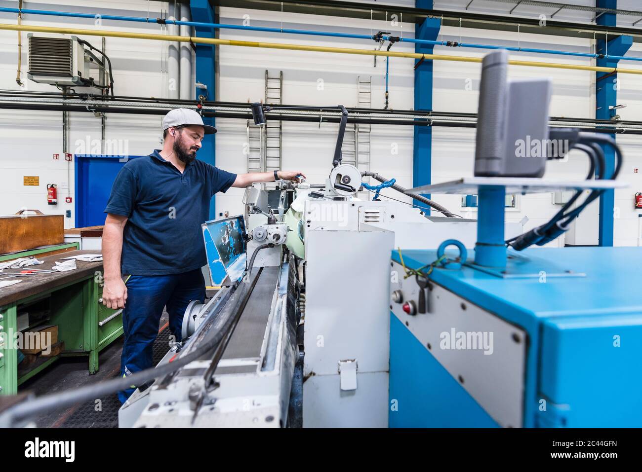 Machine operating man hi-res stock photography and images - Alamy