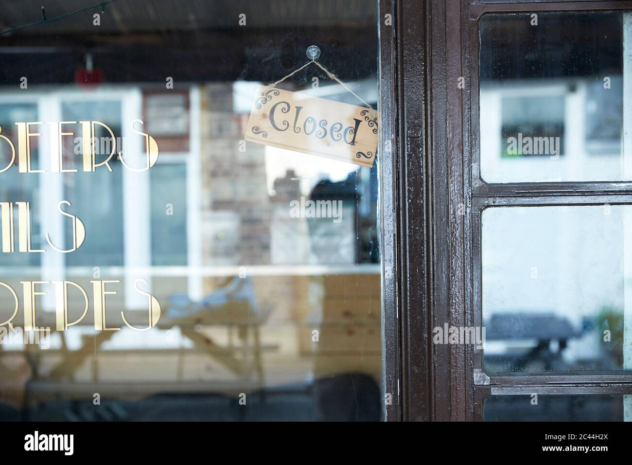UK, England, London, Closed sign hanging behind shiny window Stock ...