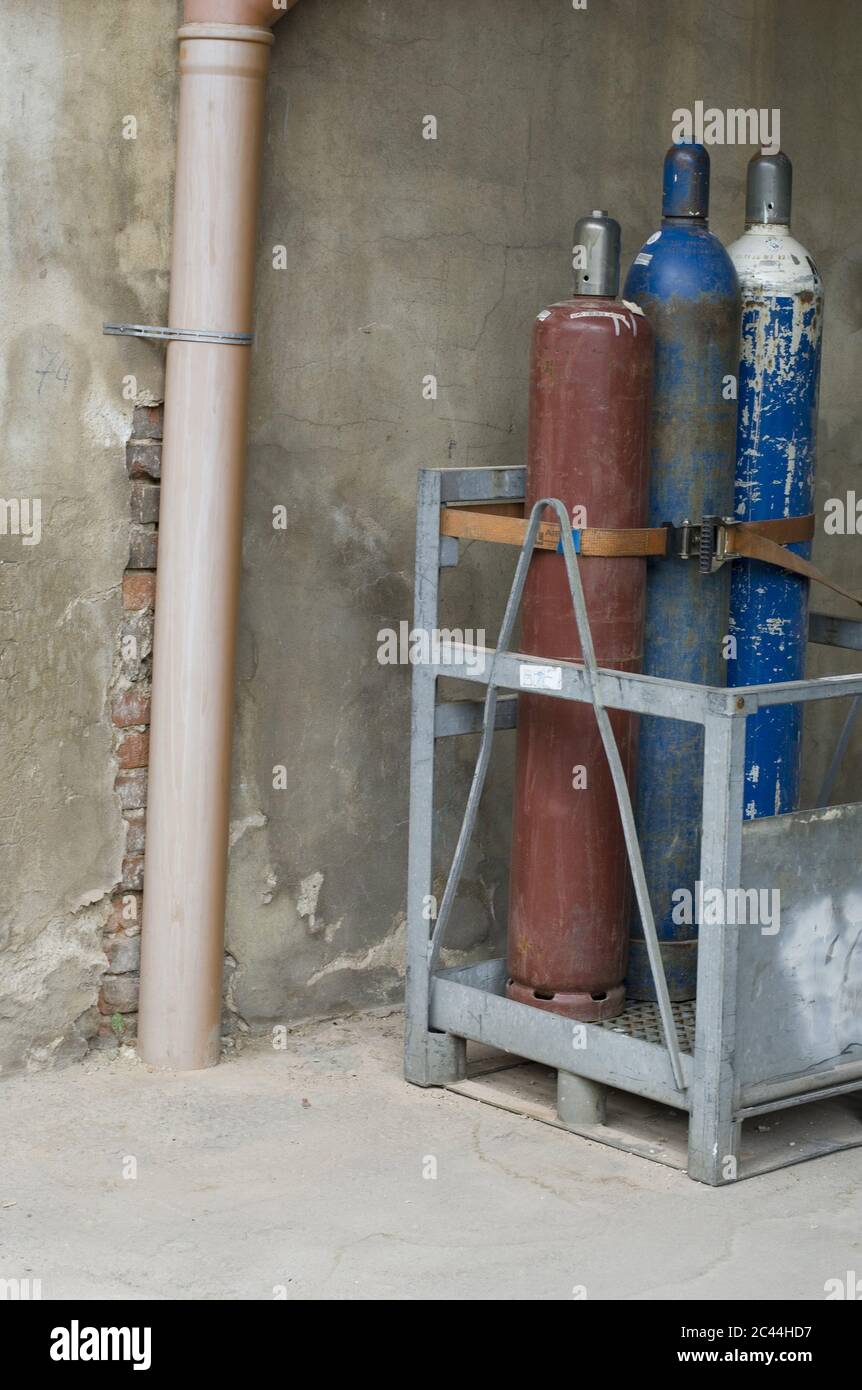Gas bottles in a back yard Stock Photo - Alamy