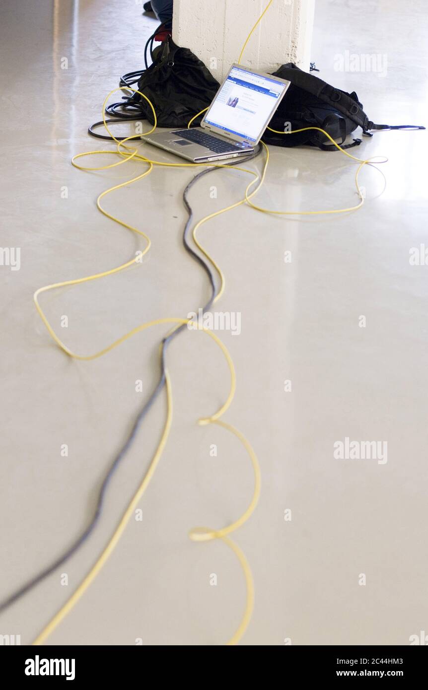 Laptop on the floor Stock Photo - Alamy
