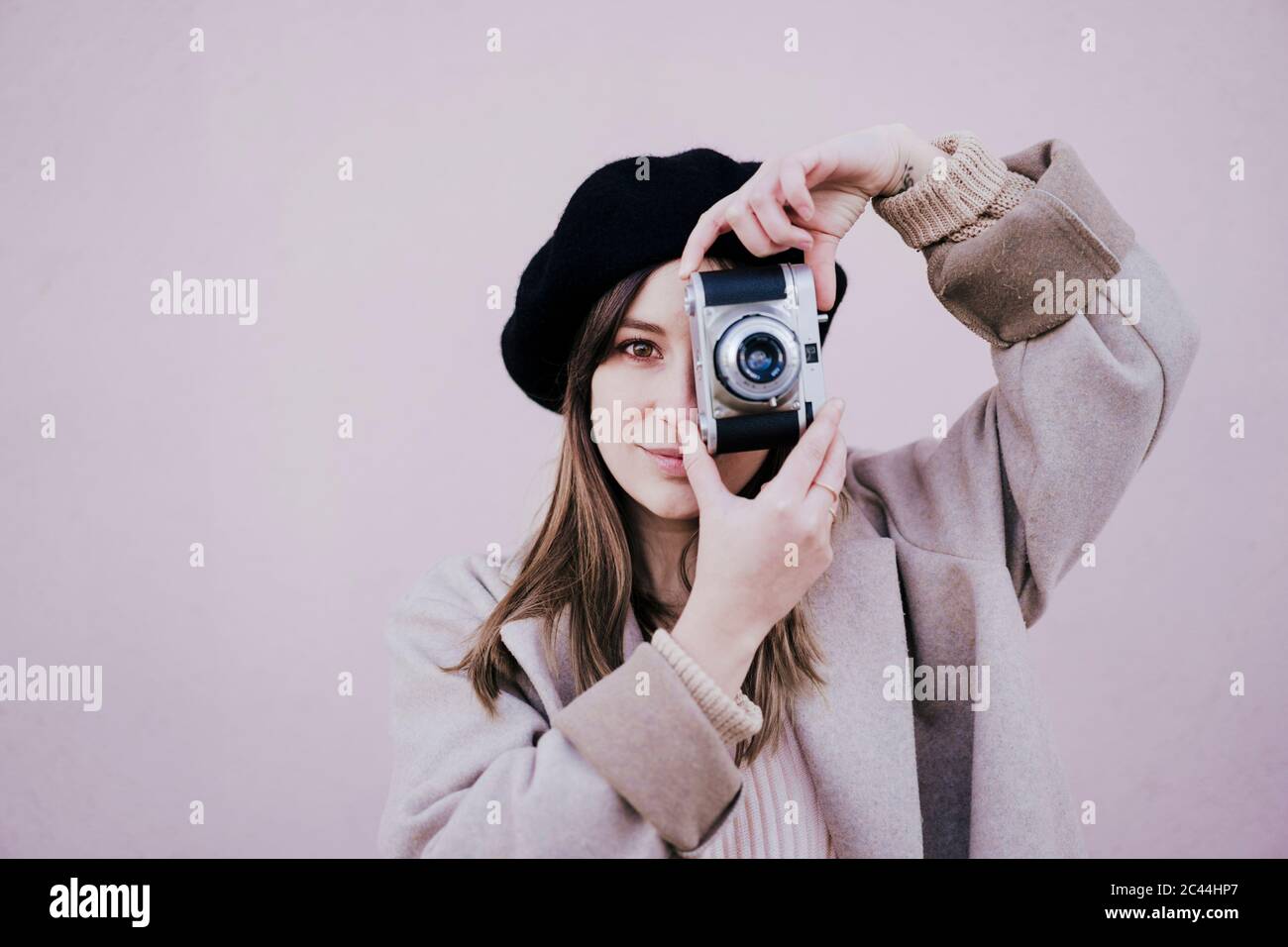 Portrait of smiling woman with vintage camera Stock Photo - Alamy