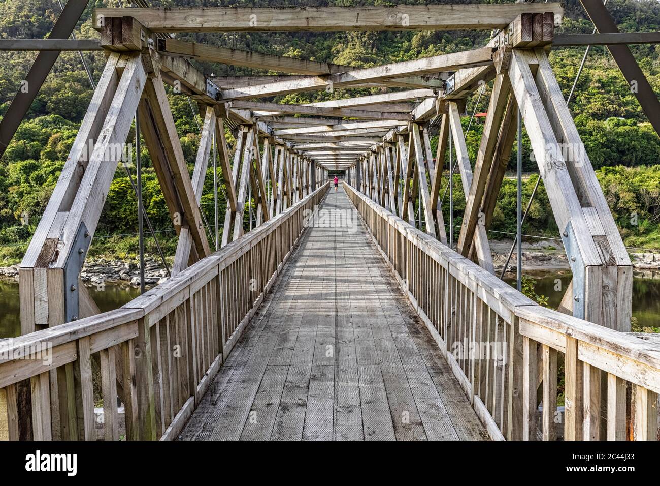 New Zealand, Diminishing perspective of wooden bridge at Brunner Mine ...