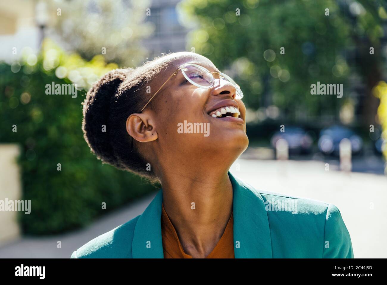 Portrait of laughing young businesswoman wearing glasses Stock Photo ...