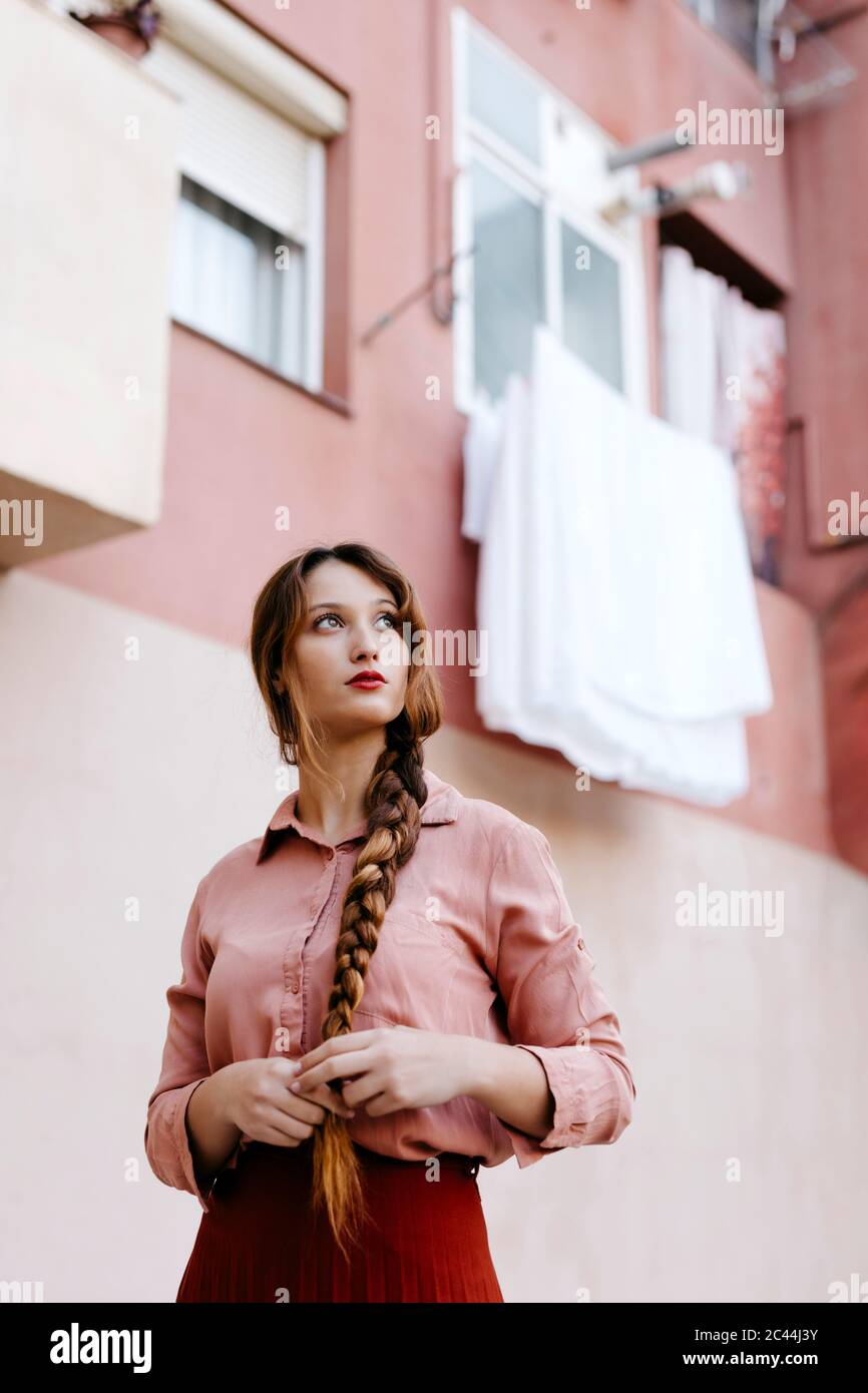 Portrait of young woman with braid wearing vintage clothes Stock Photo ...