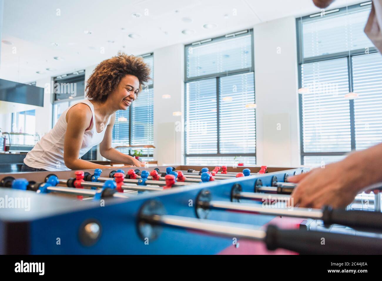 Young business people playing football in their lunch break Stock Photo ...