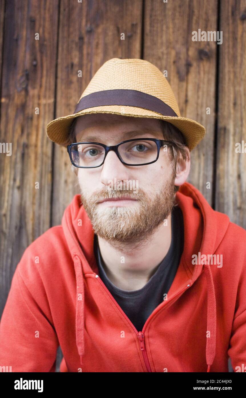 Man in front of a wooden hut Stock Photo - Alamy
