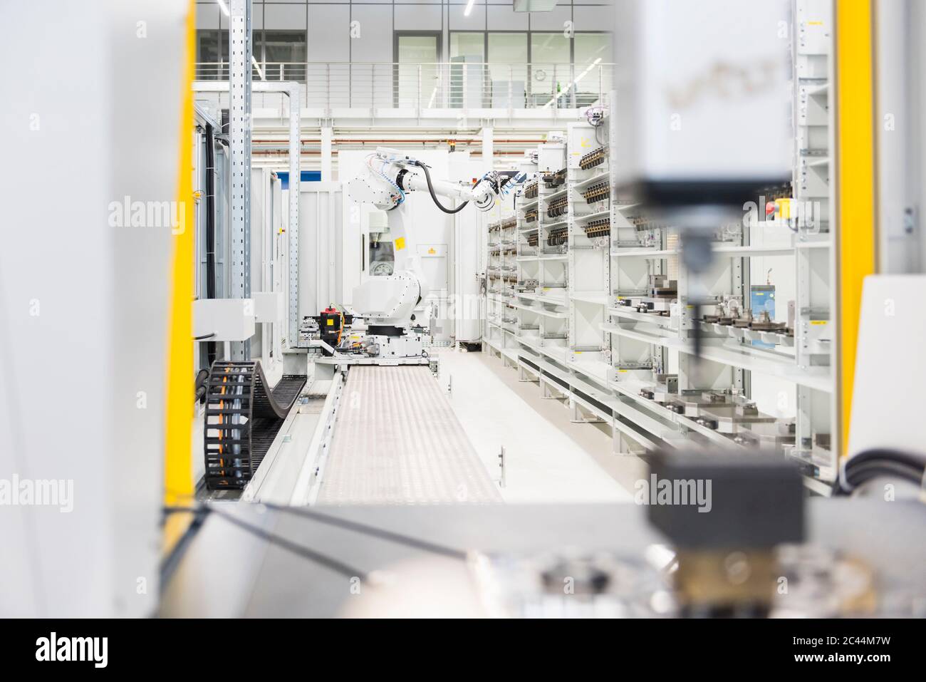 Machinery in empty factory shop floor Stock Photo - Alamy