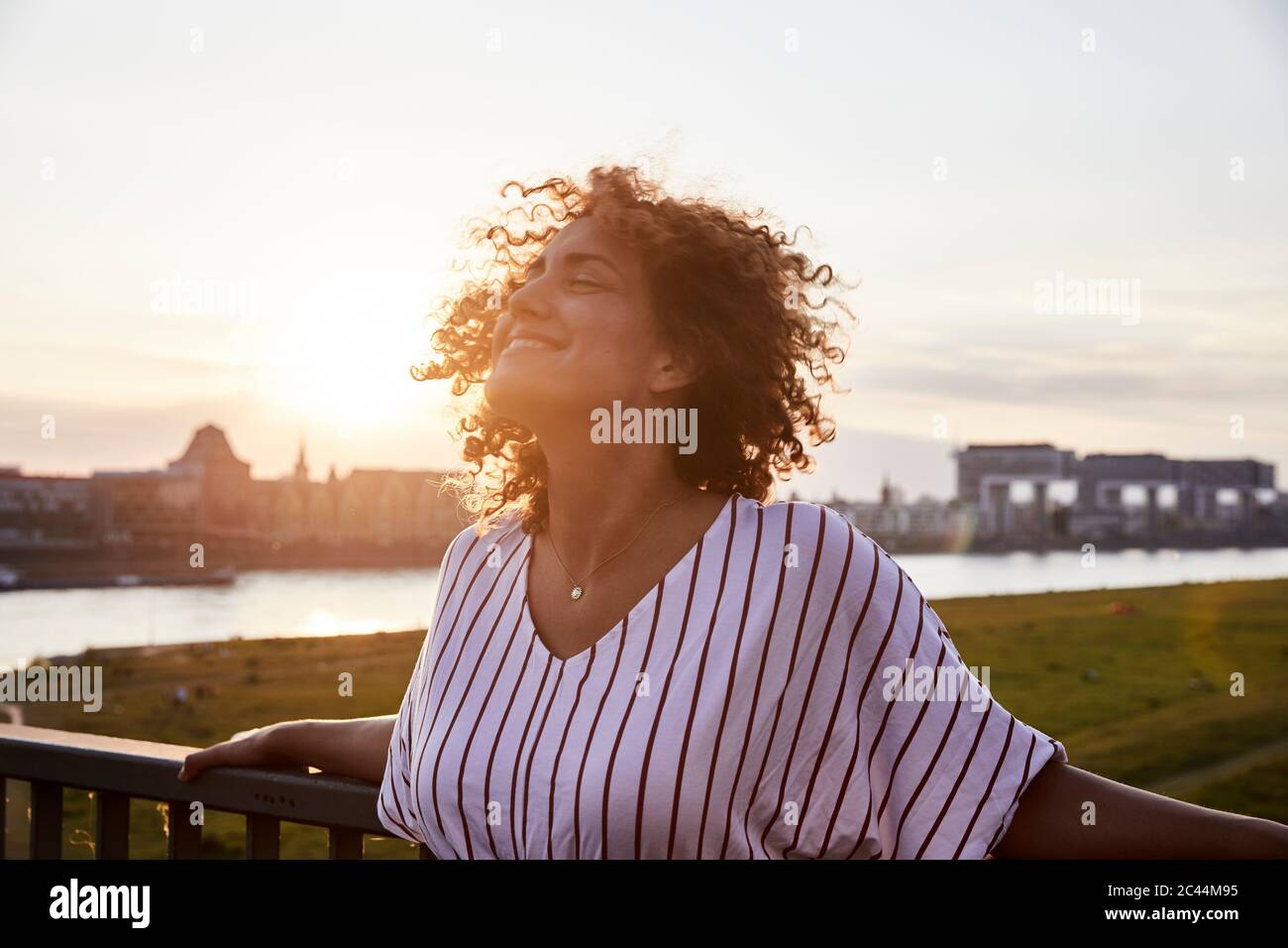 Woman enjoying beauty of evening sky hi-res stock photography and ...