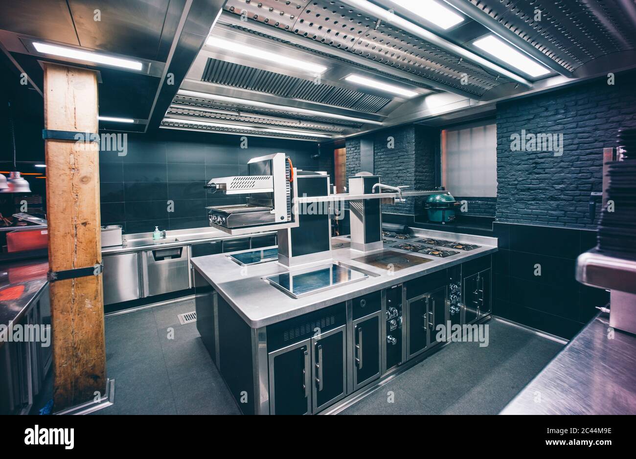 Illuminated kitchen counter in clean restaurant Stock Photo - Alamy