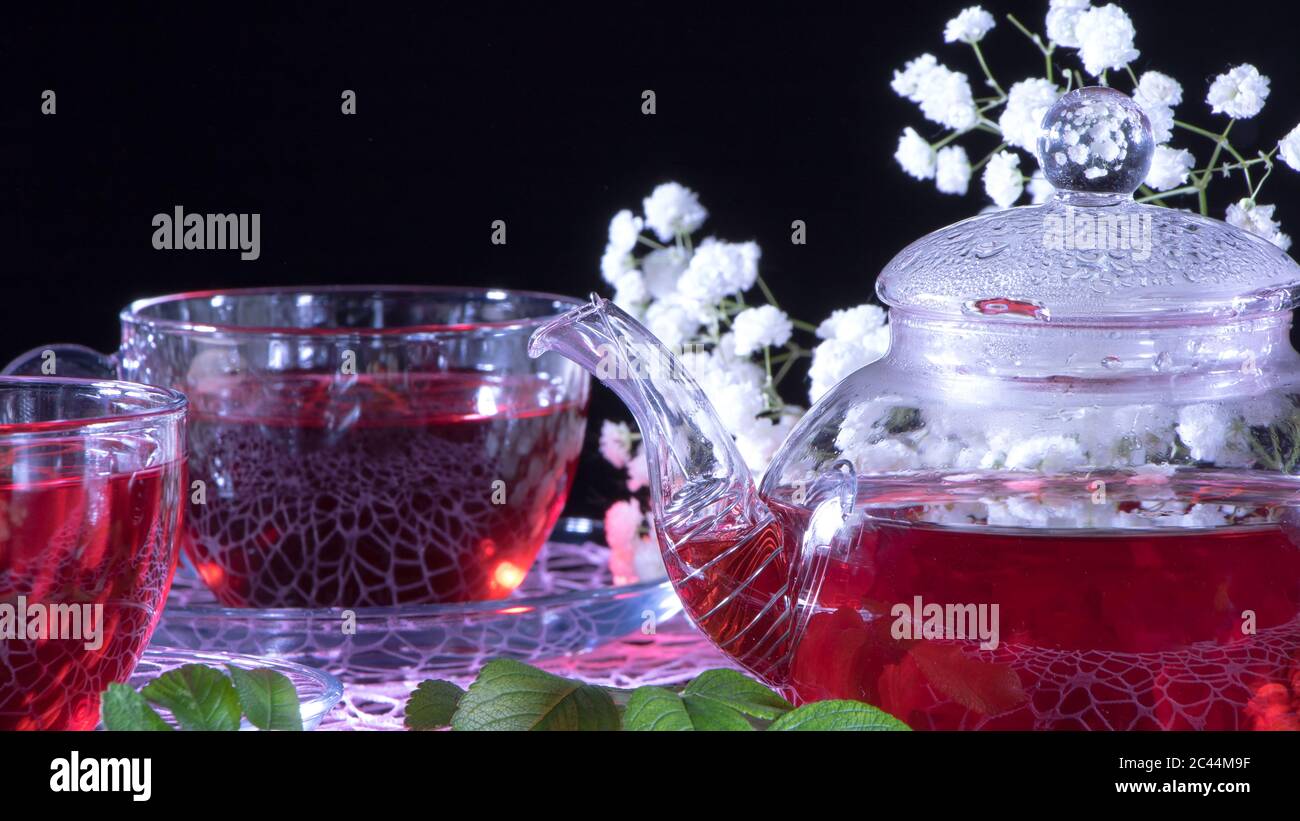 Mugs of red tea with carnation flowers. Zen tea ceremony. English tea ...