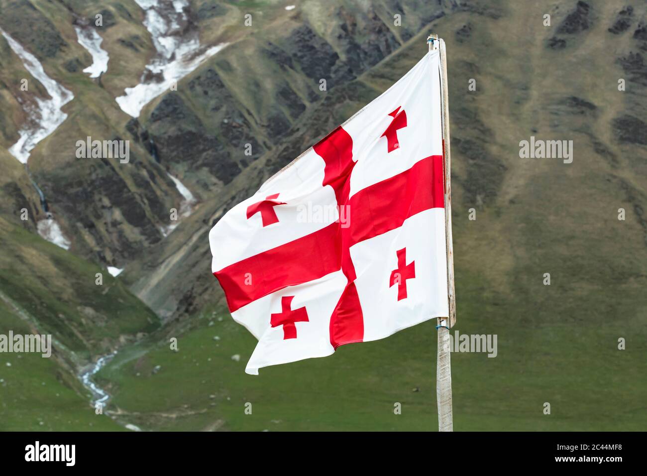 Georgia, Svaneti, Ushguli, Georgian national flag fluttering outdoors ...