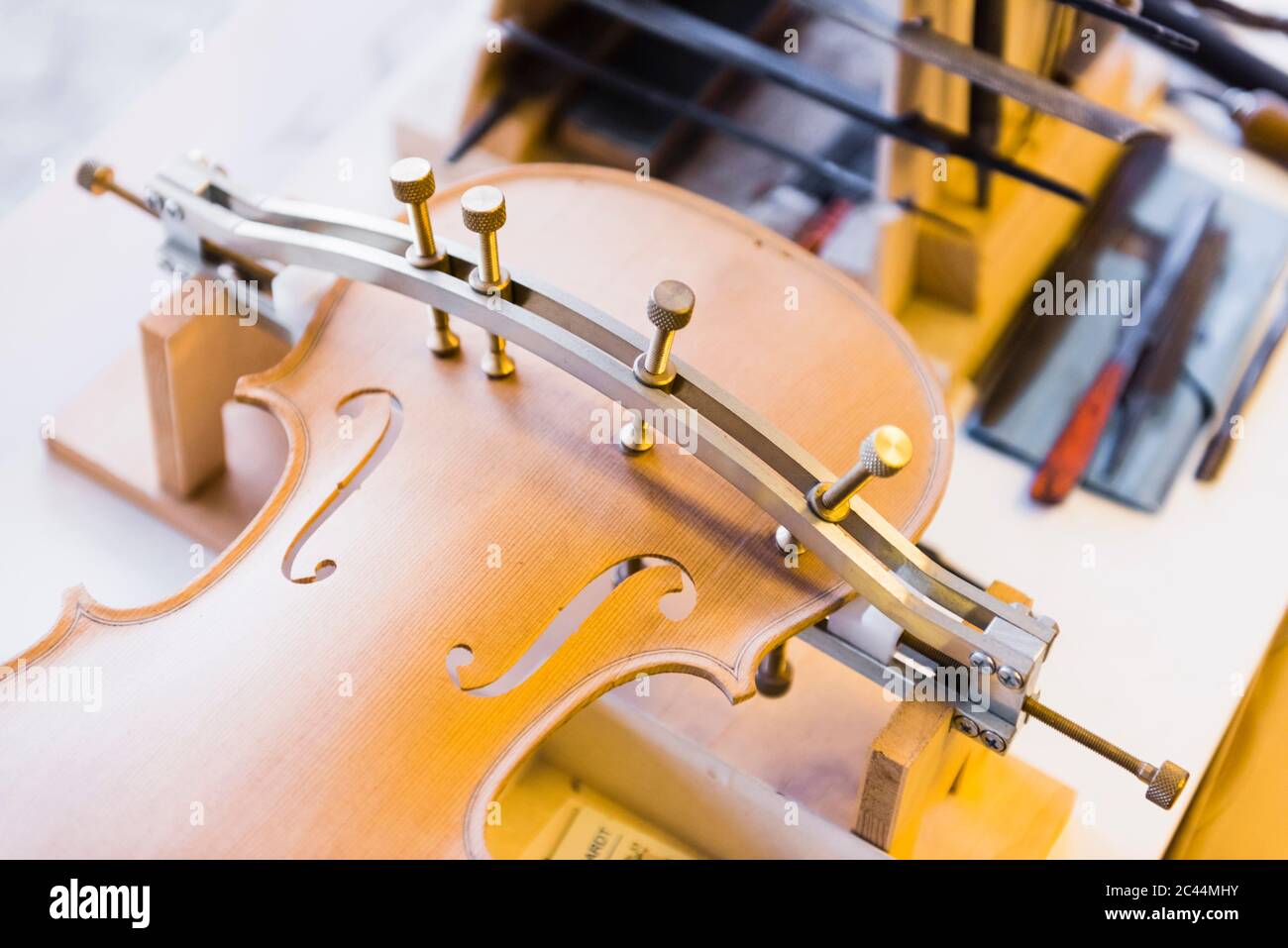 Violin making, violin in clip Stock Photo - Alamy