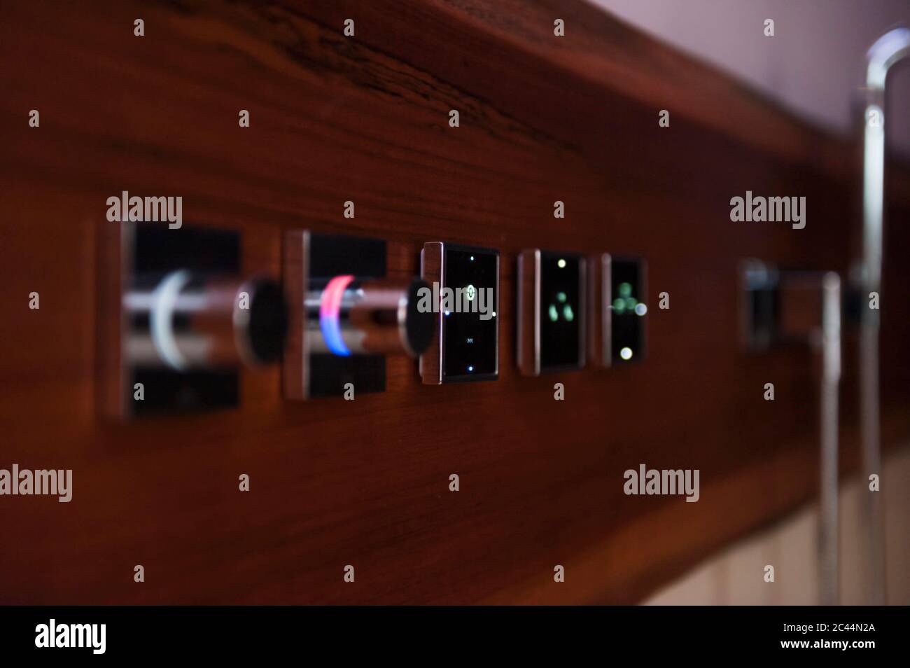 Digital push buttons of kitchen sink on wall Stock Photo - Alamy