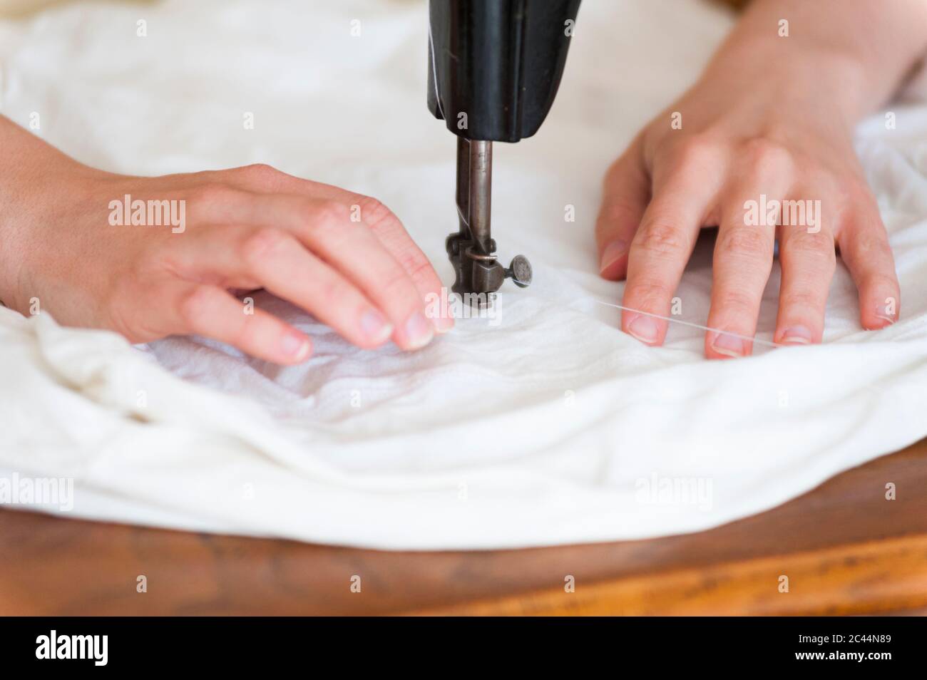 Womans hands using old sewing machine hi-res stock photography and ...