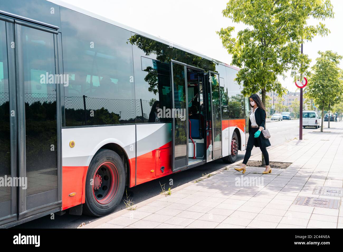 Woman wearing one rubber glove hi-res stock photography and images - Alamy