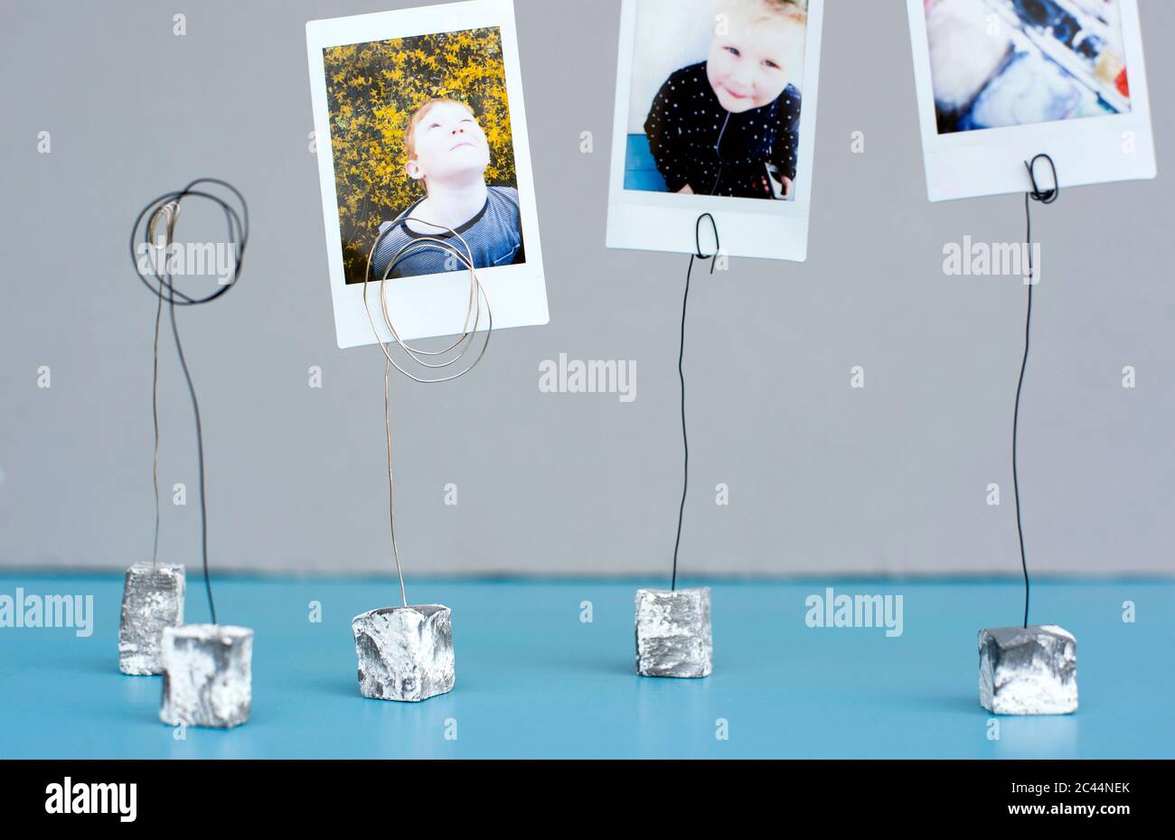 Simple photo holders made from clay and wires Stock Photo - Alamy
