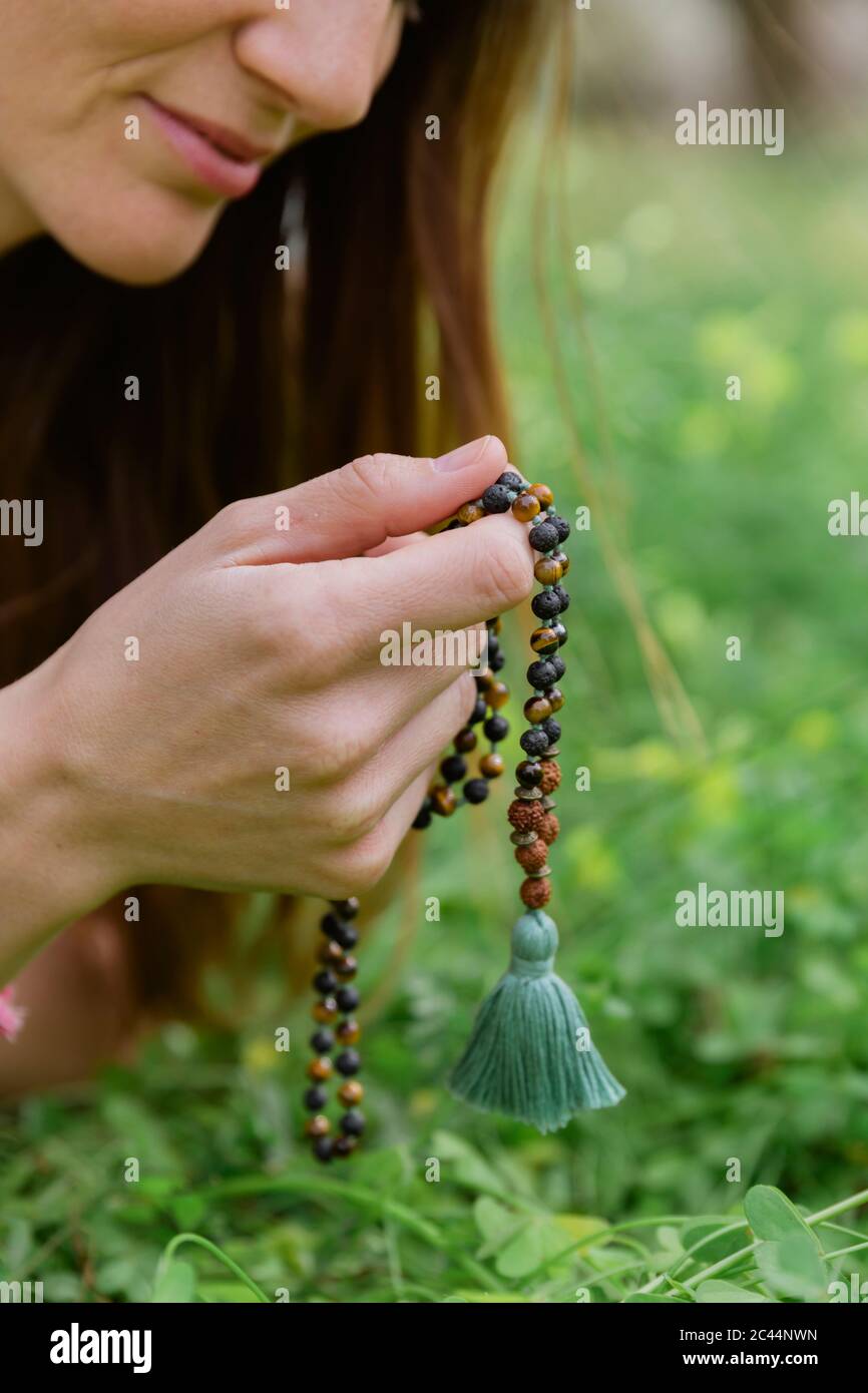 Woman with beads hi-res stock photography and images - Alamy