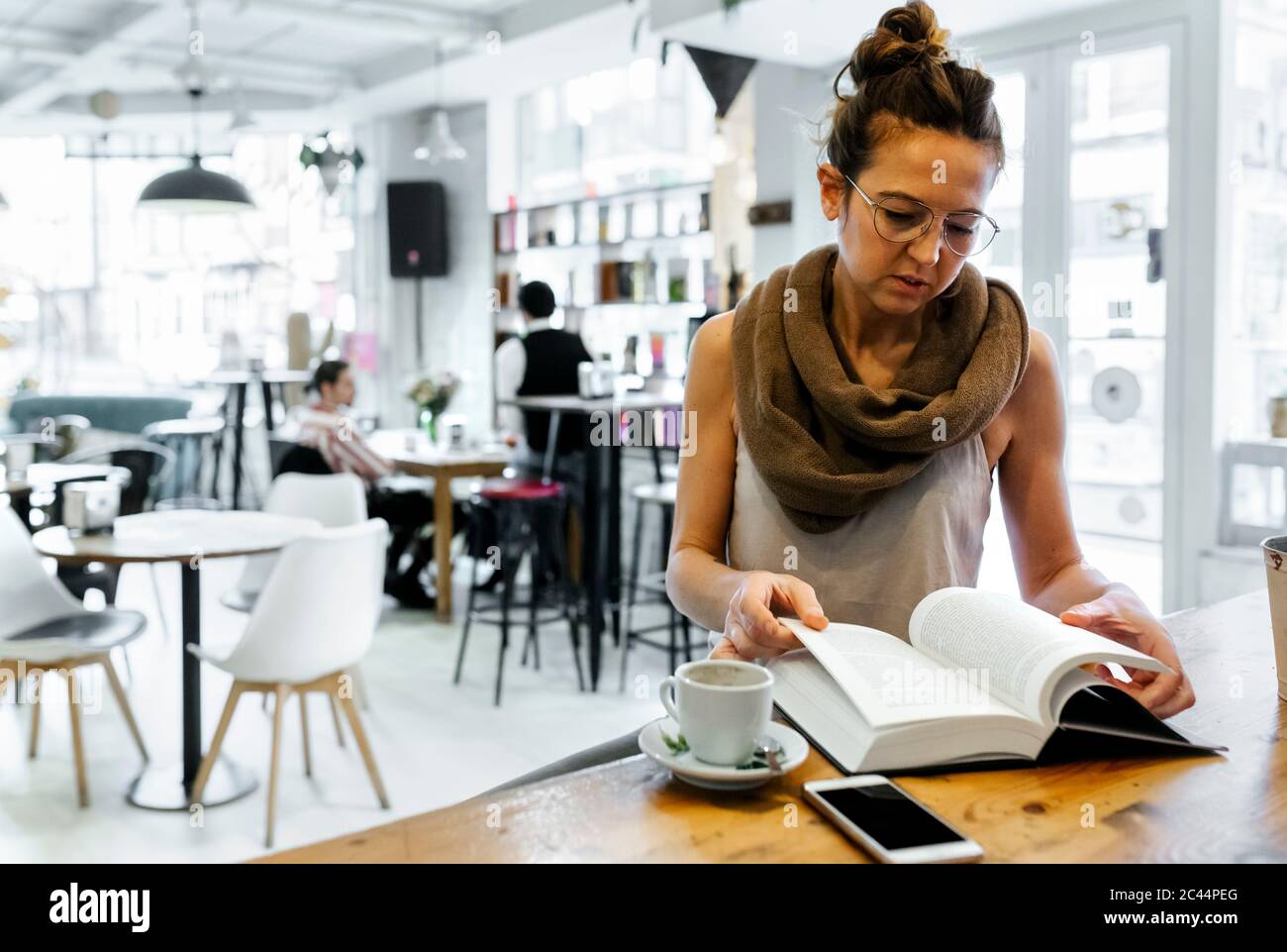 Freelancer woman reading book hi-res stock photography and images - Alamy