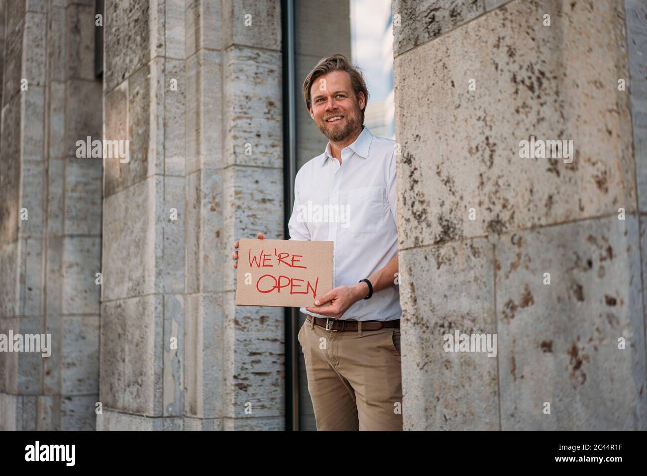 Smiling shopkeeper hi-res stock photography and images - Alamy