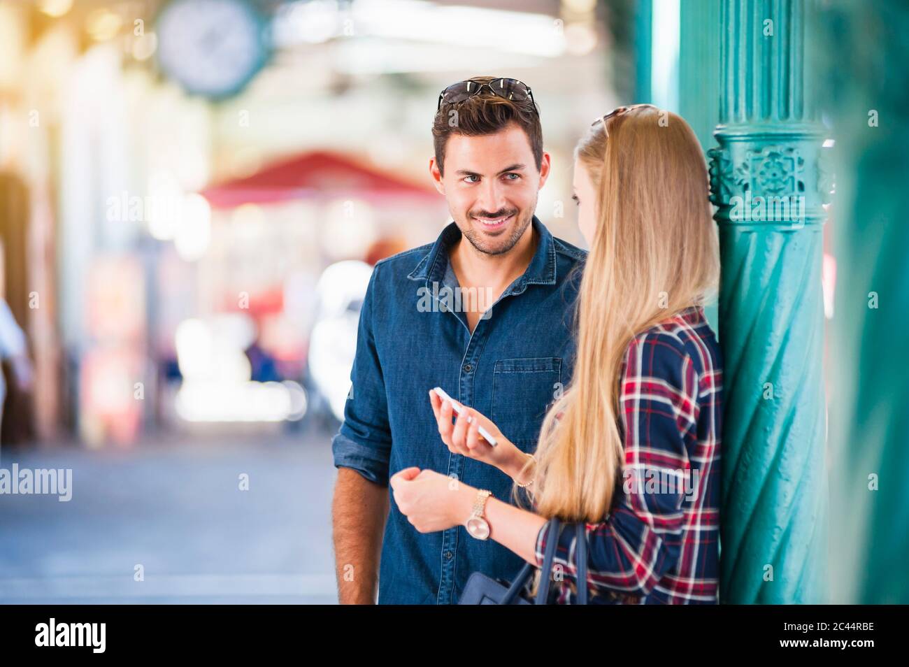 Young couple talking together Stock Photo - Alamy