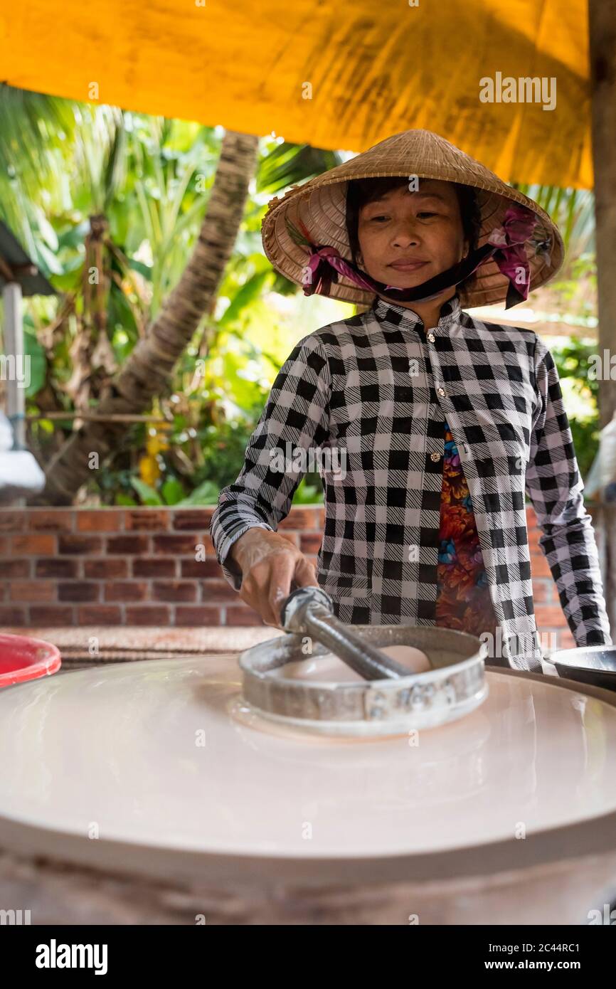 Woman cooking noodles hi-res stock photography and images - Alamy