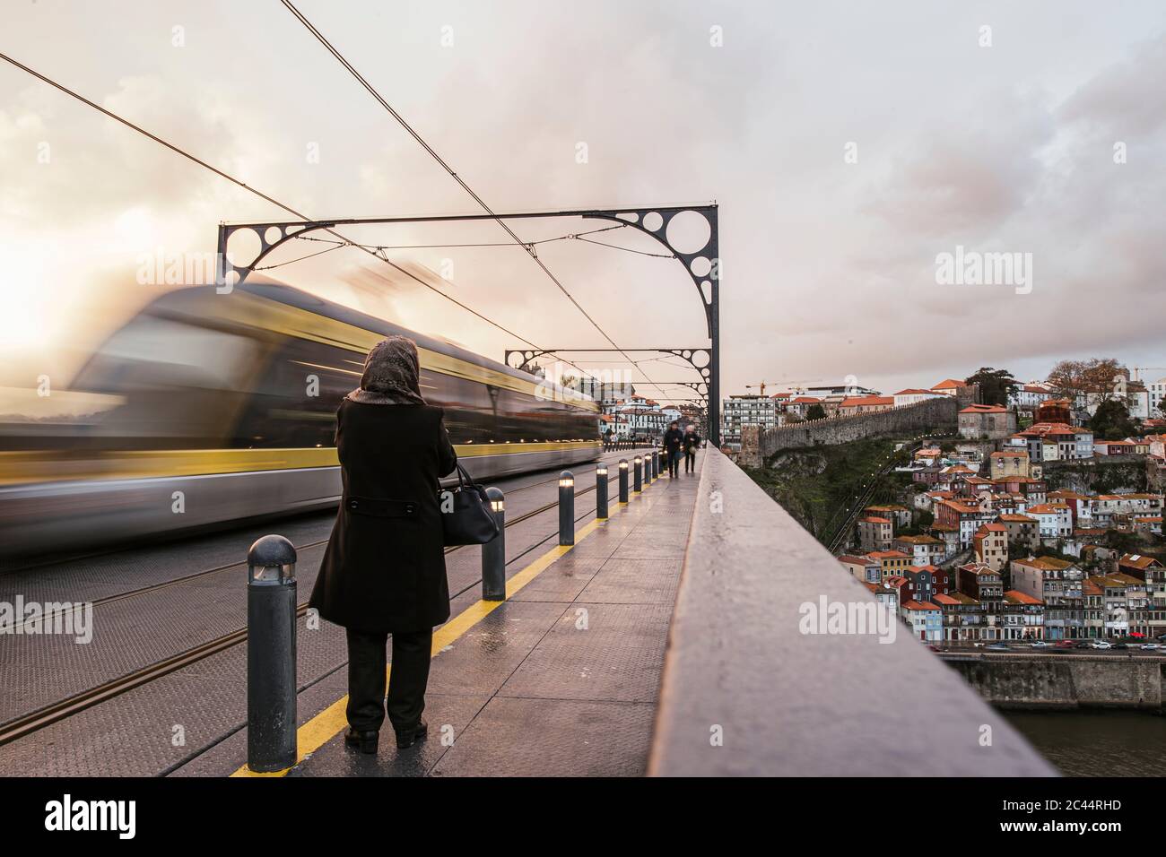 Blurred motion subway train passing elevated railway track dusk hi-res ...