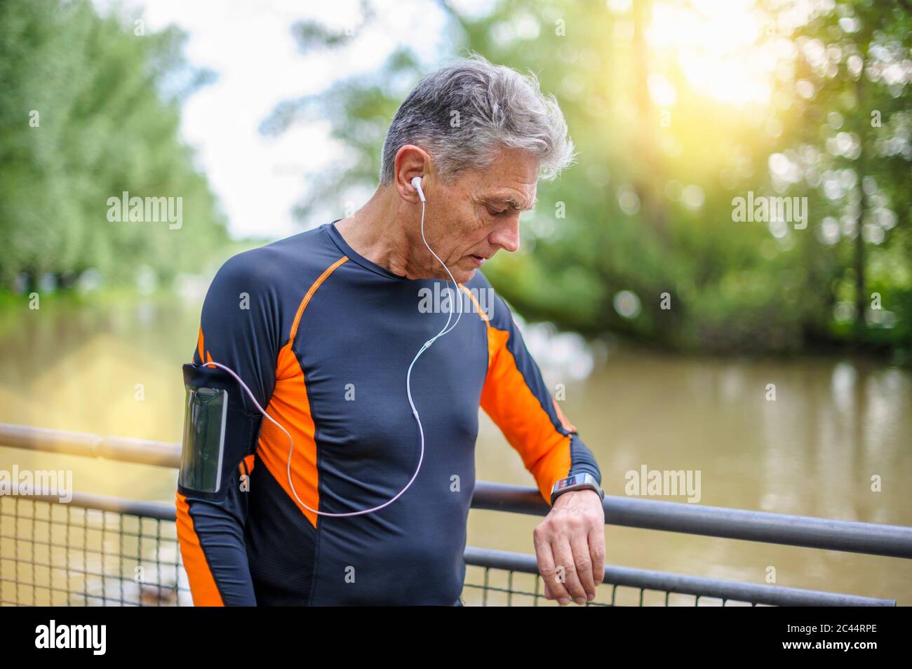 Senior man looking at her watch hi-res stock photography and images - Alamy