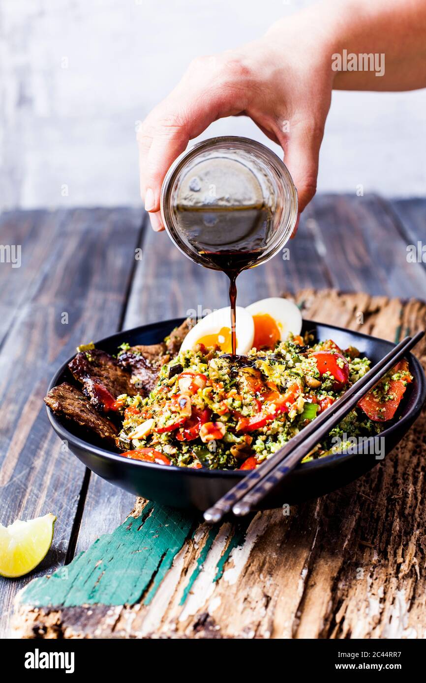 Hand pouring rice hi-res stock photography and images - Alamy