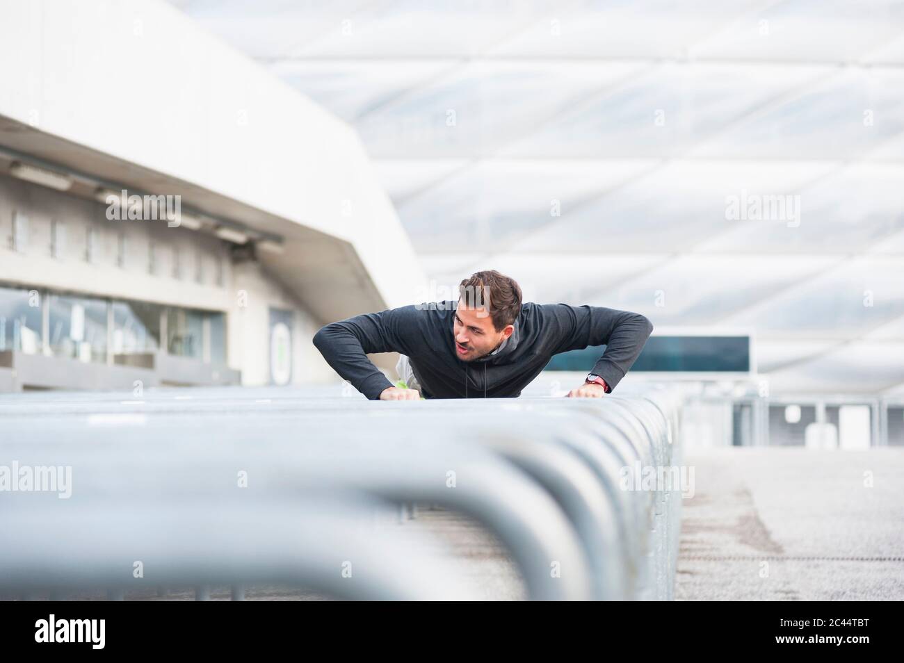Muscle man leaning on railing hi-res stock photography and images - Alamy