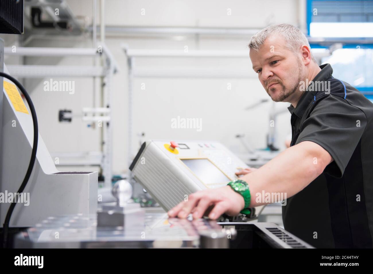 Man operating machinery hi-res stock photography and images - Alamy