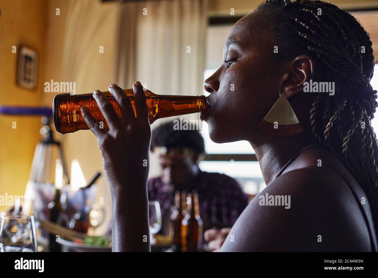 African woman drinking beer hi-res stock photography and images - Alamy