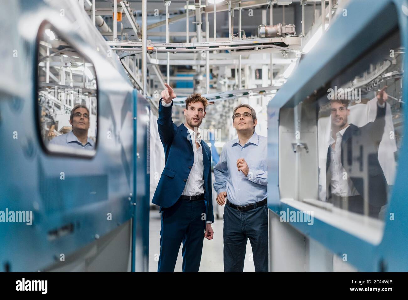 Two businessmen having a meeting in a factory Stock Photo - Alamy