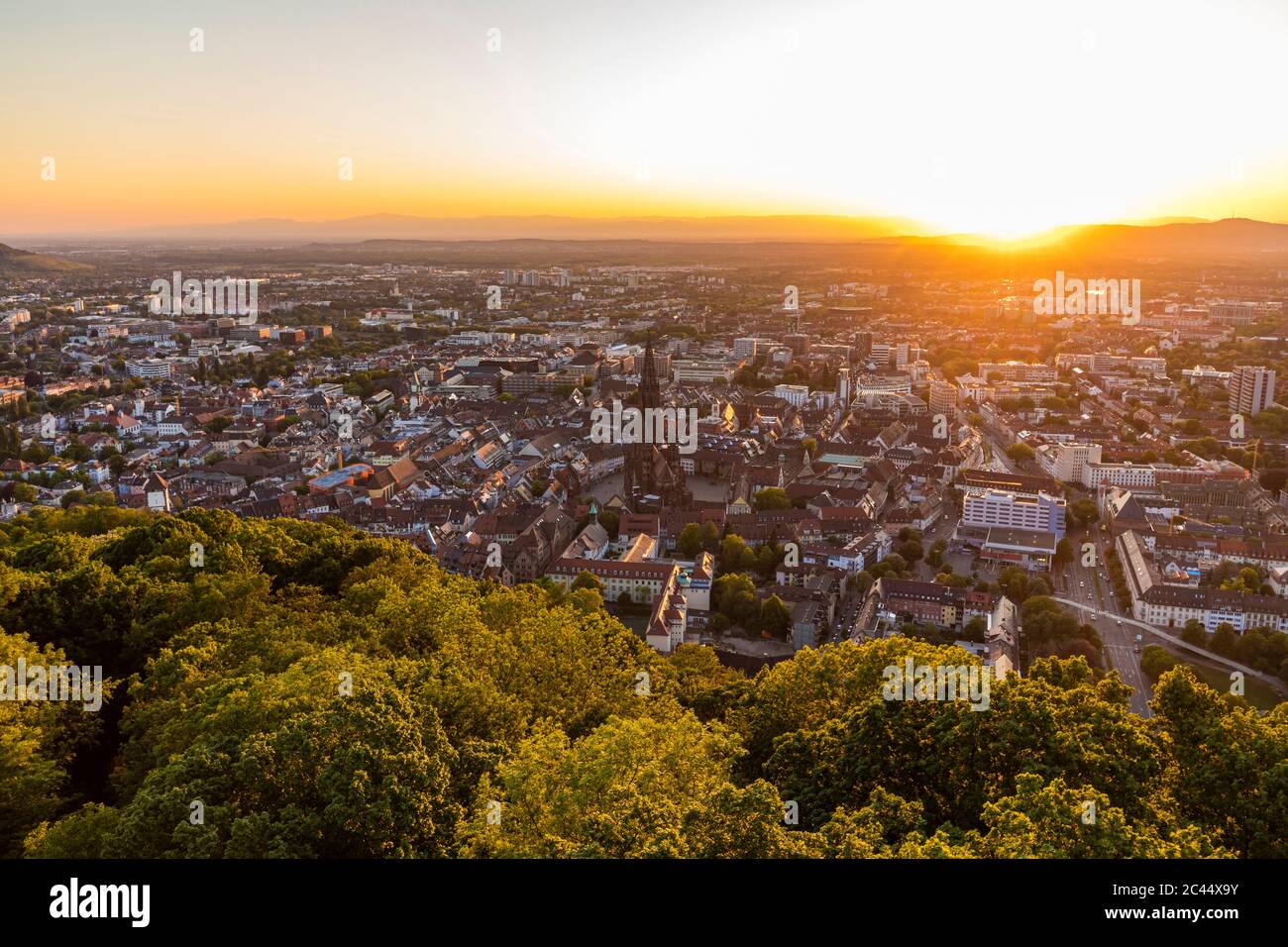 Germany, Baden-Wurttemberg, Freiburg im Breisgau, Sunset over city seen from summit of ...