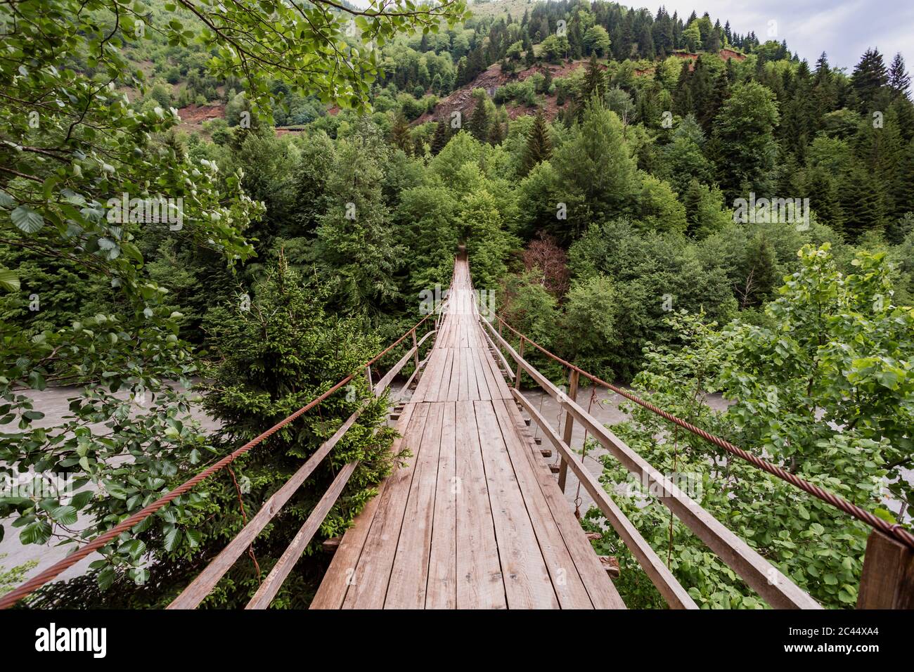 Georgia, Wooden suspension bridge stretching over river Stock Photo - Alamy