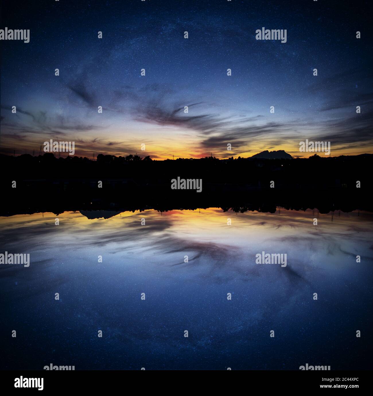 Reflection of the starry night sky on the water Stock Photo - Alamy