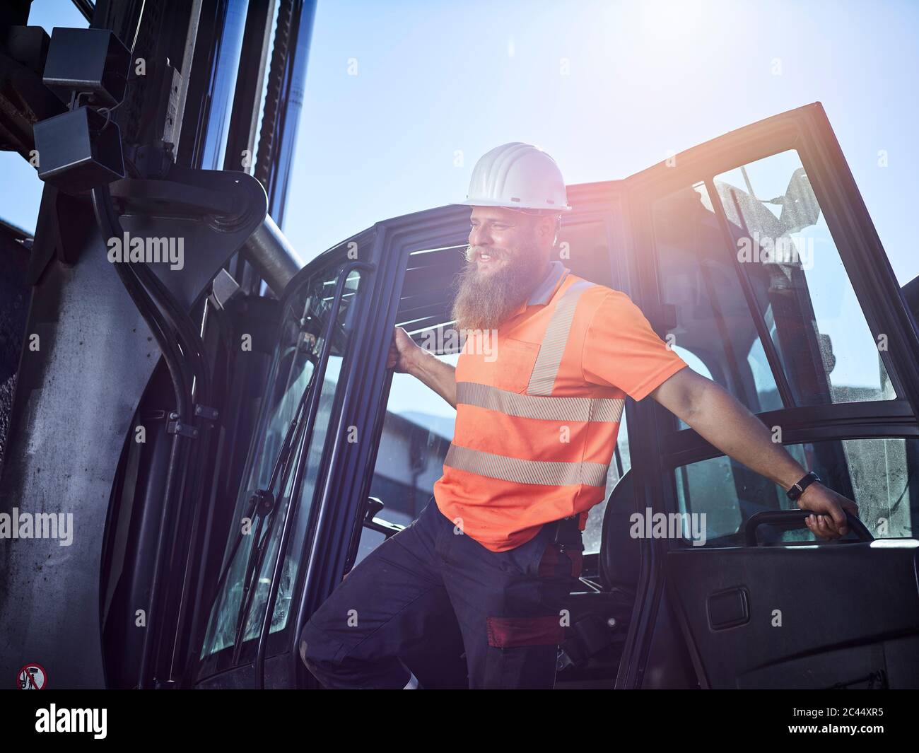 Construction worker wearing reflecting clothing hardhat standing by ...