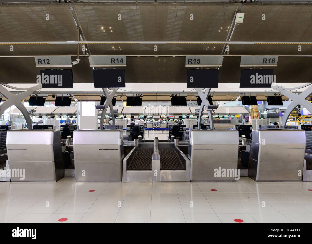 Front view of check-in area in airport Stock Photo - Alamy