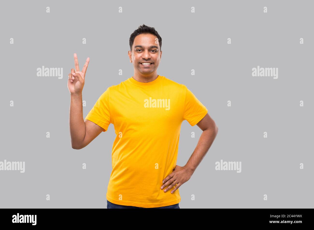 Indian man Showing Peace Sign Isolated Smilling Stock Photo - Alamy