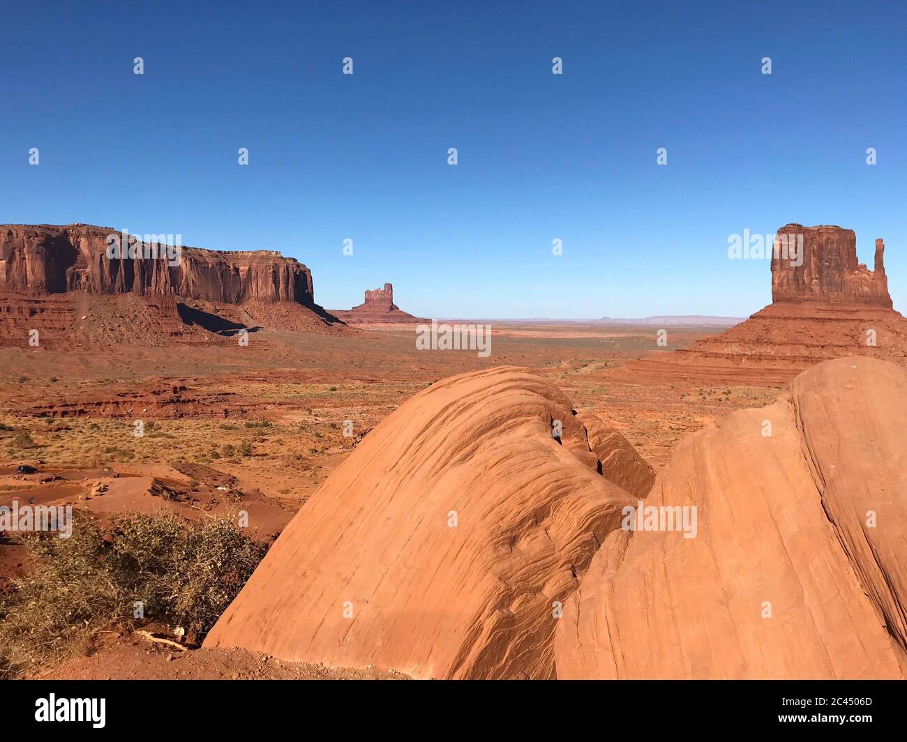 Amazing view of Monument Valley with red desert and blue sky and clouds ...