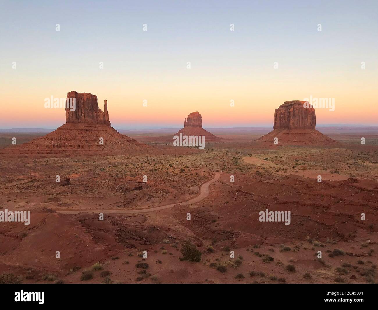 Amazing view of Monument Valley with red desert and blue sky and clouds ...