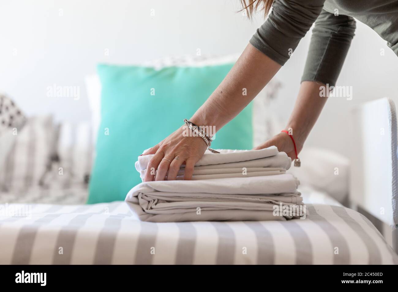 Closeup of a female holding folded clothes Stock Photo - Alamy