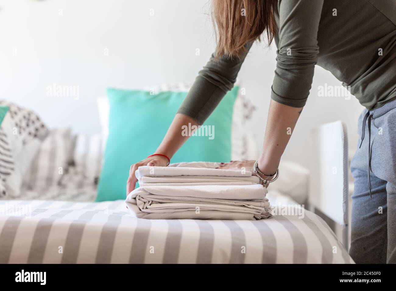Closeup of a female holding folded clothes Stock Photo - Alamy